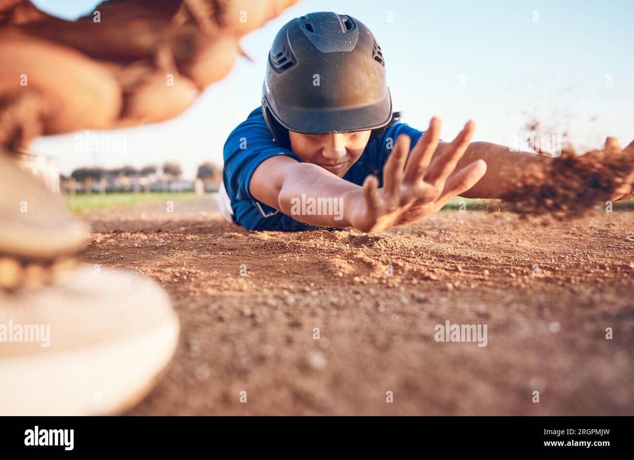 Slide, baseball action and player in a match or game for sports ...