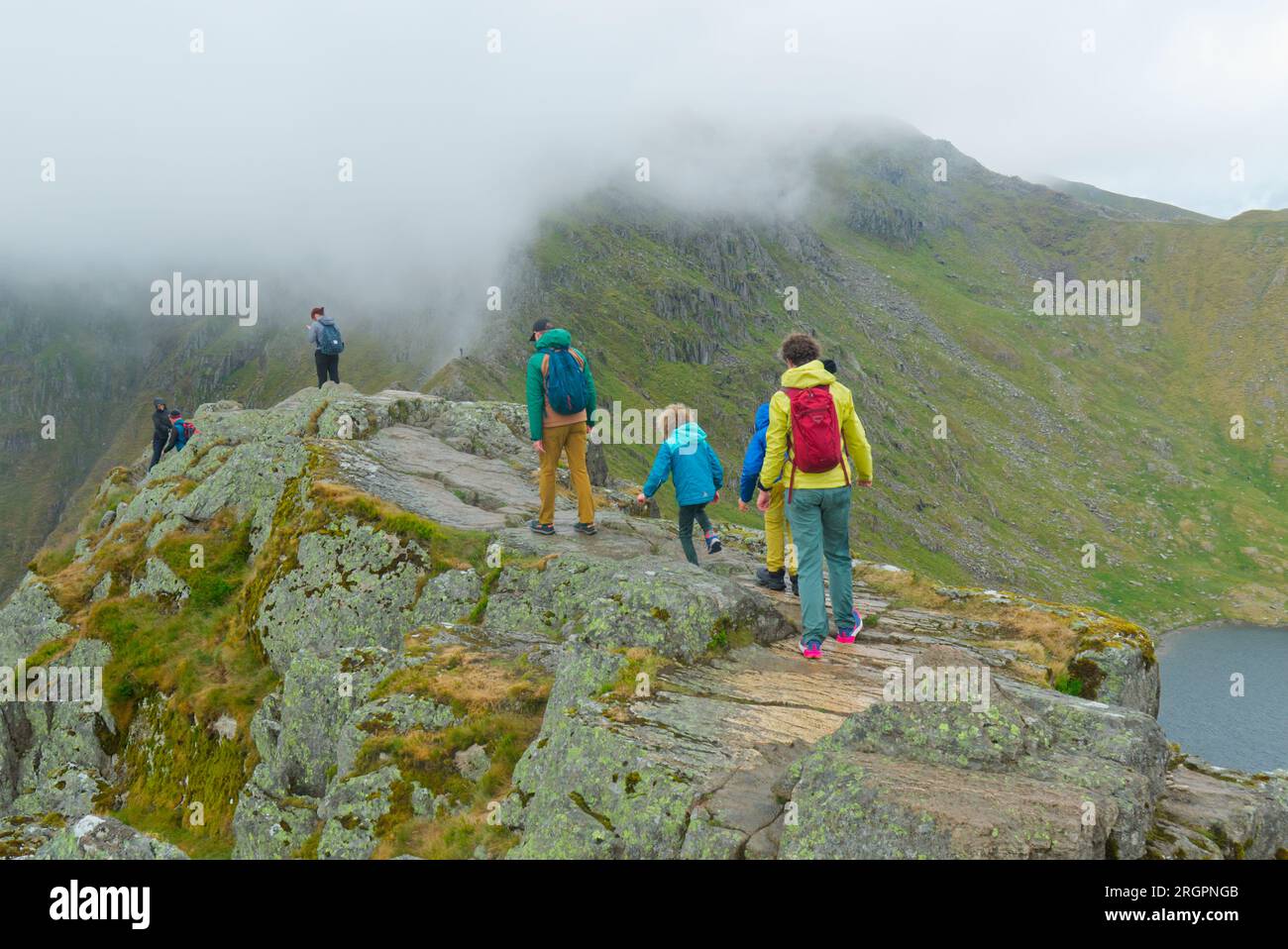 Walkers on Striding Edge, Helvellyn mountain, Cumbria Stock Photo - Alamy