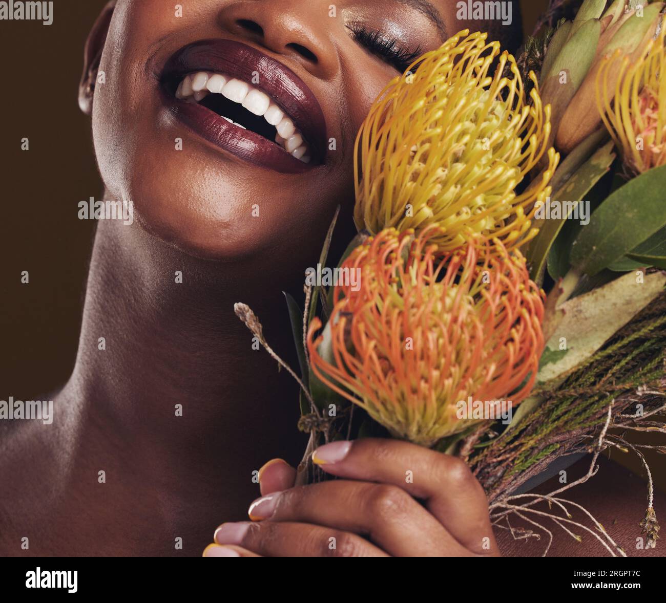 Smile, beauty and protea with the face of a black woman in studio on ...