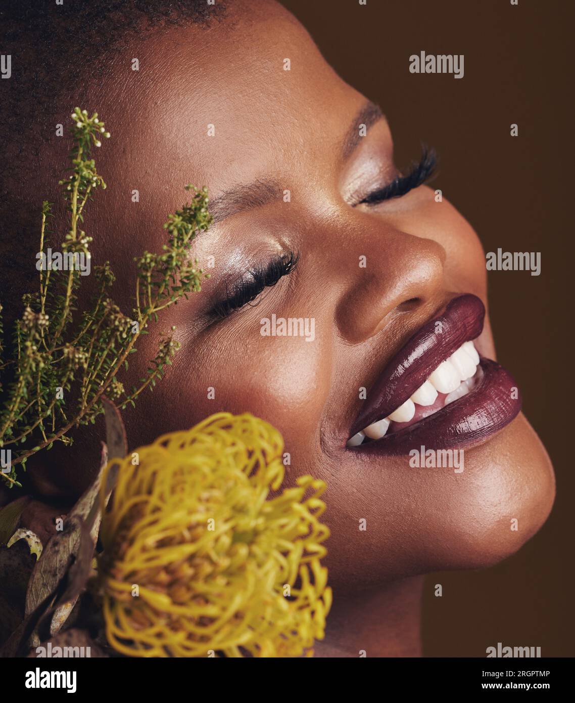 Face, beauty and protea with the smile of a black woman in studio on ...