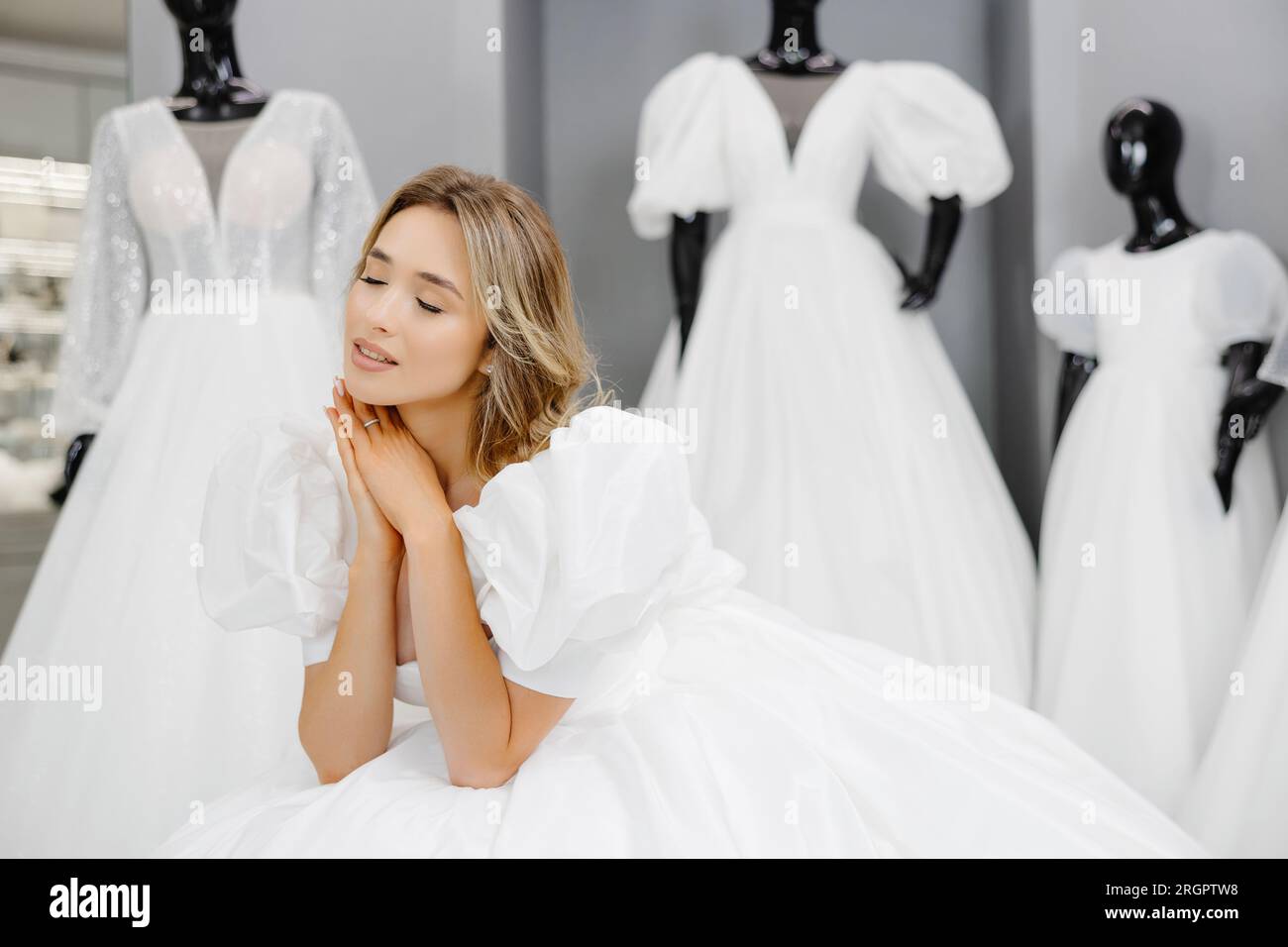 Woman wedding dress fitting hi-res stock photography and images - Alamy