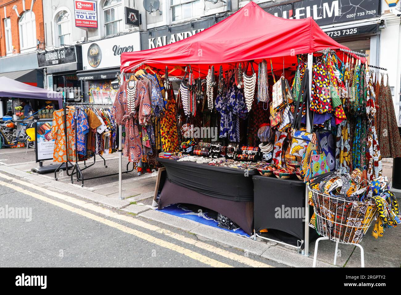 Stalls with ethnic African and Afro Caribbean clothes and souvenirs ...