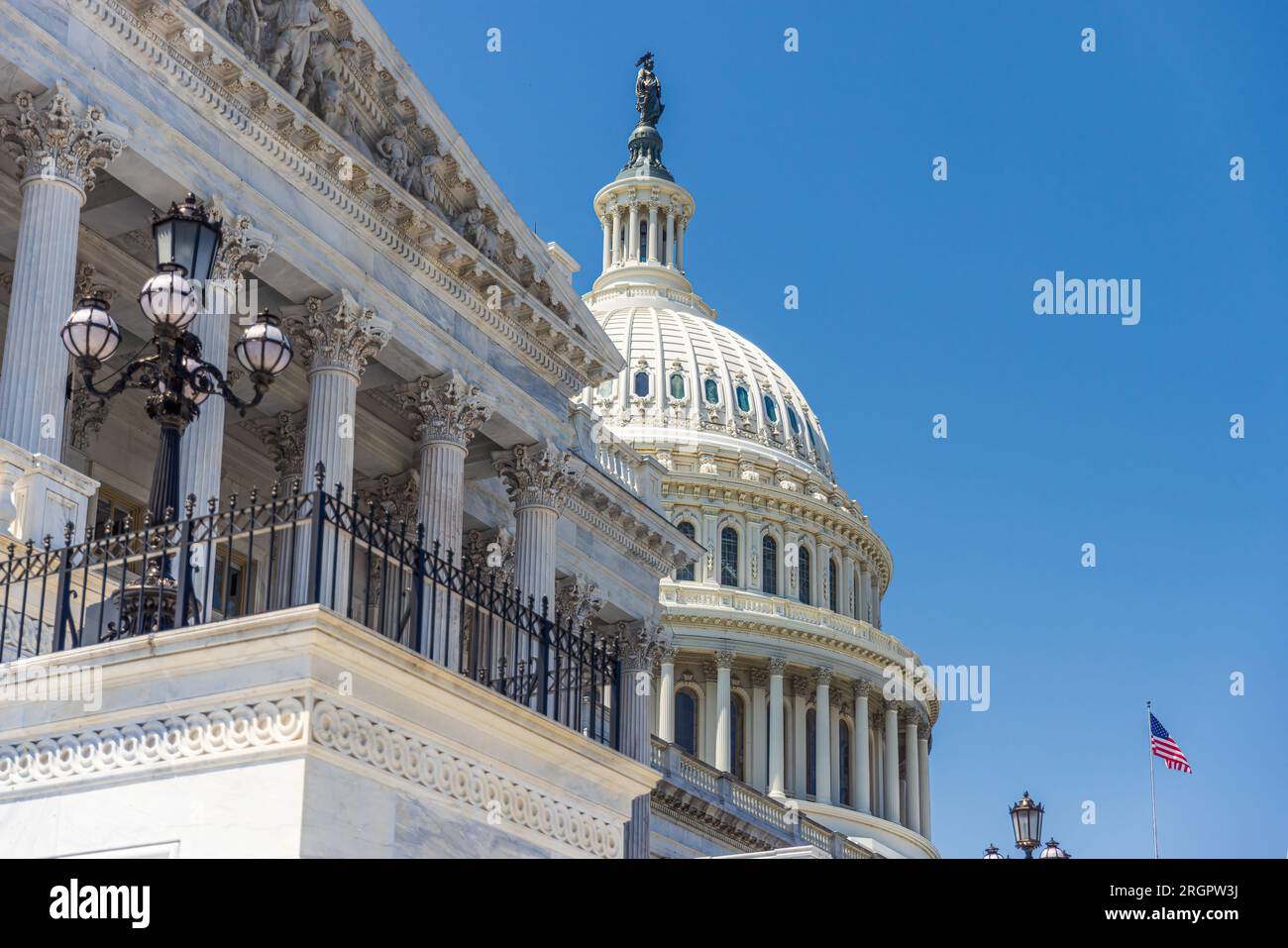 The United States Capitol building with American flag, Washington DC ...