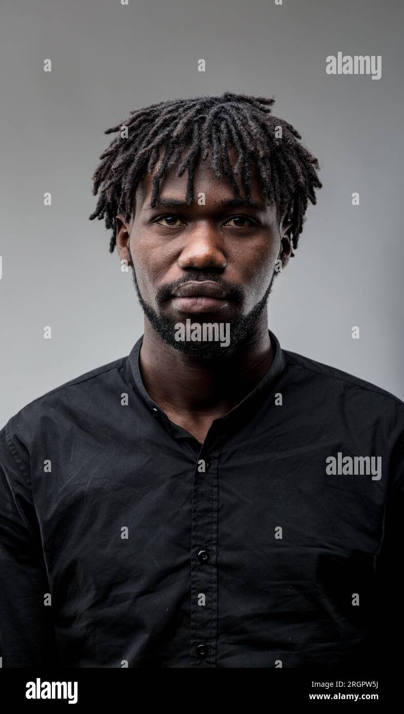 Black man with short braids over his face. Neat beard, appearance ...