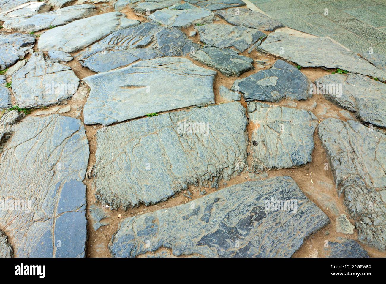 gray stone ground in a park, looks very old Stock Photo - Alamy