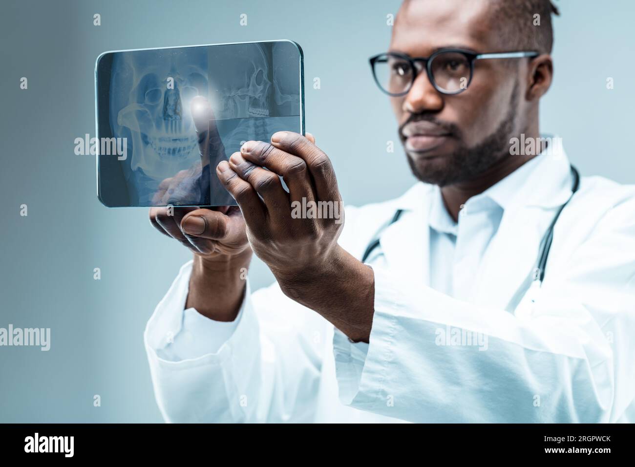 Doctor using high-tech tablet. Mobile apps, digital technologies ...