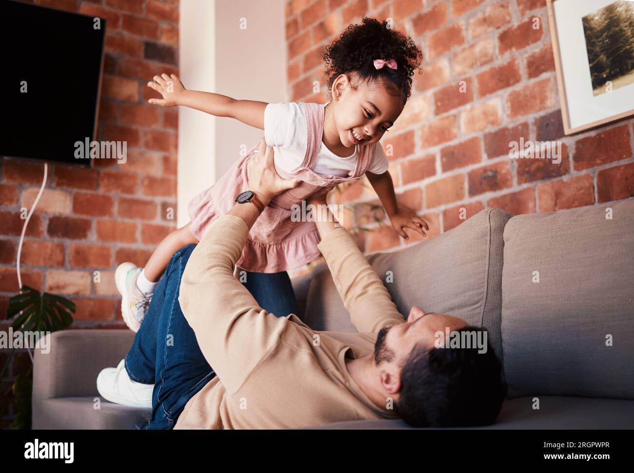 Couch, airplane and father playing child or daughter enjoy game as ...