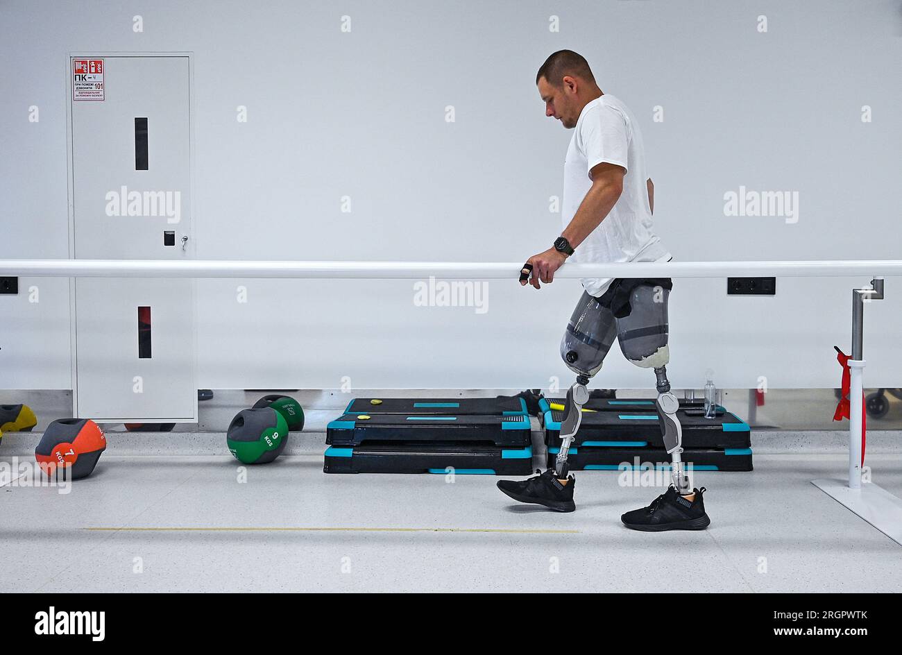 VYNNYKY, UKRAINE - AUGUST 9, 2023 - Patient Volodymyr tries to walk ...