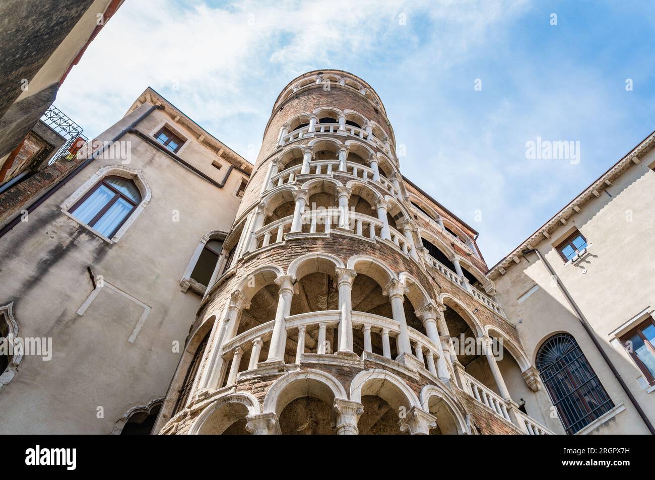 View with the facade and the spiral staircase (scala) of Palazzo ...
