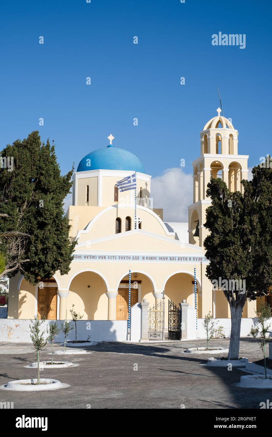 Saint Georgios Oia Holy Orthodox Church, a yellow church with a blue ...