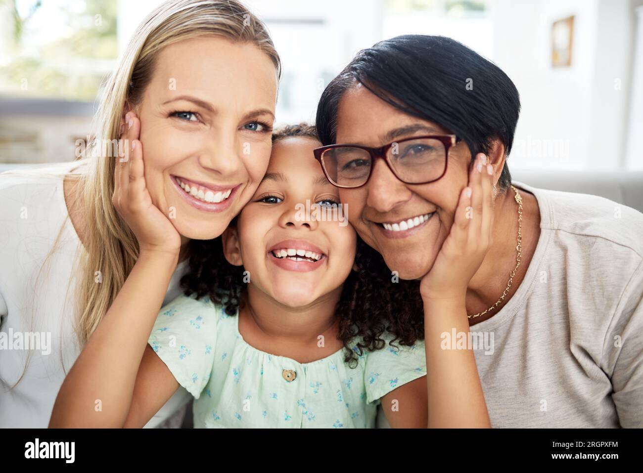 Interracial family, portrait and home with smile, bonding and care with ...