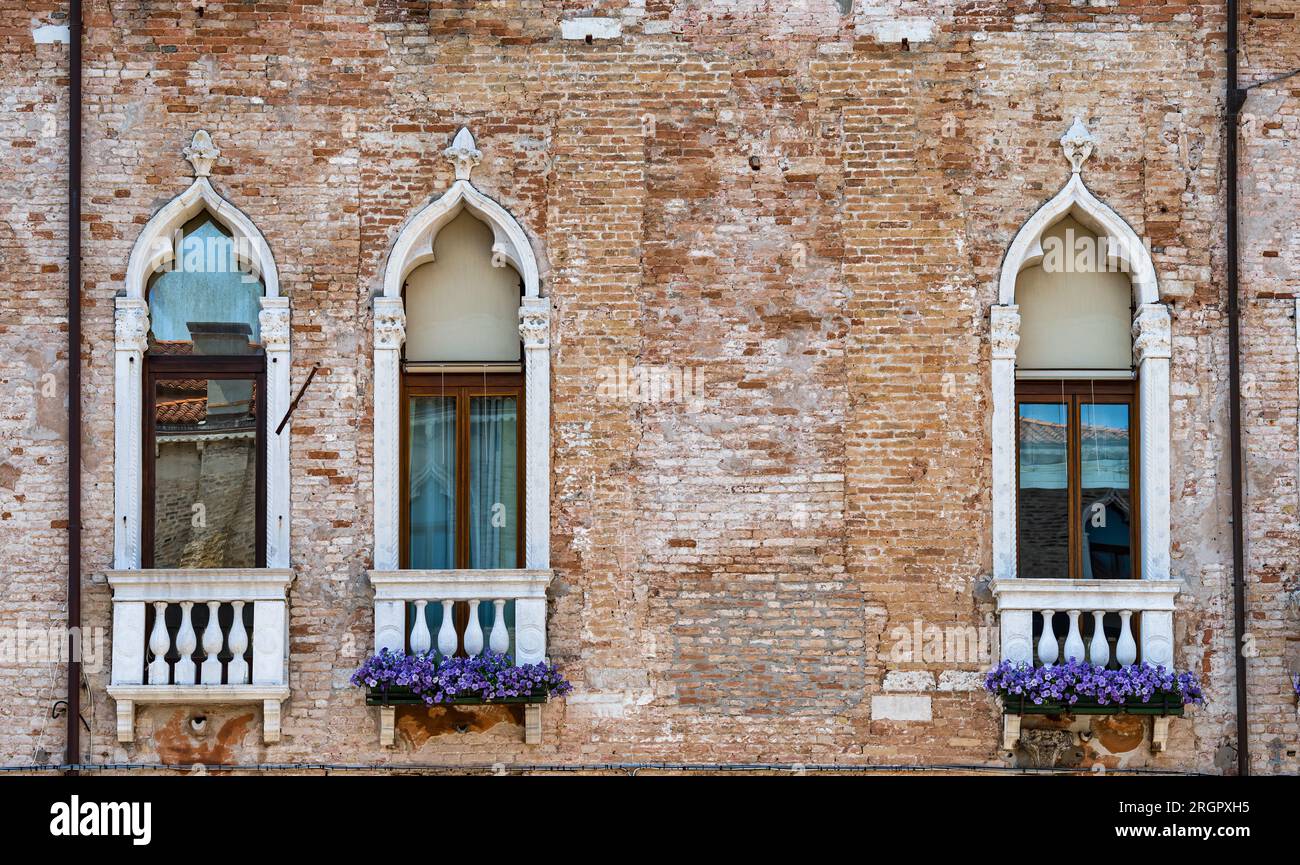 Close up detail with old medieval architecture venetian window and ...
