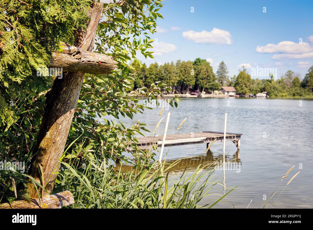 A wooden structure and a pier at the edge of Wilke Lake in Manitowoc ...