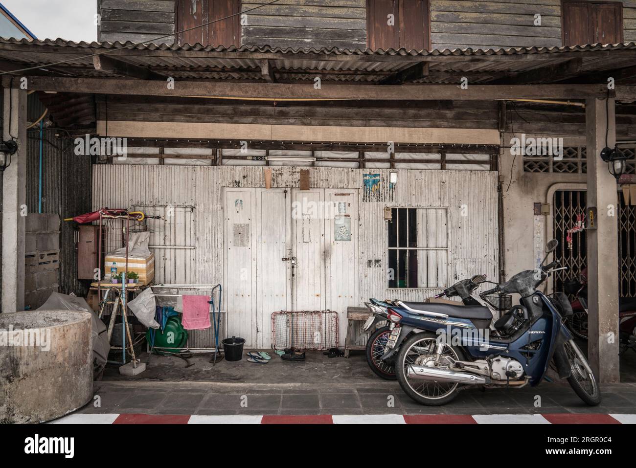 The old facade of a residential building in Thailand, the city of Takua ...
