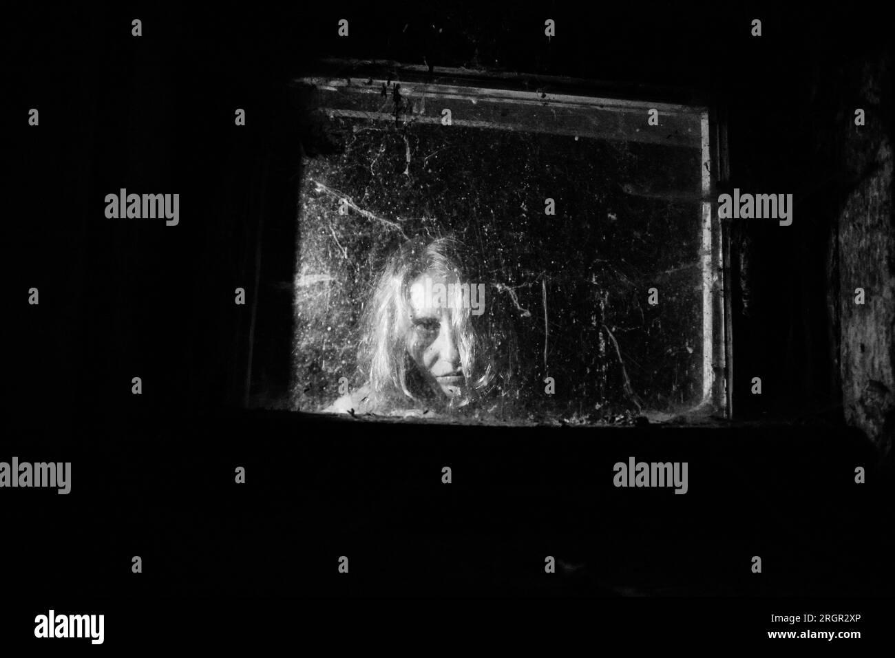 scary woman behind window at night Halloween horror background Stock ...