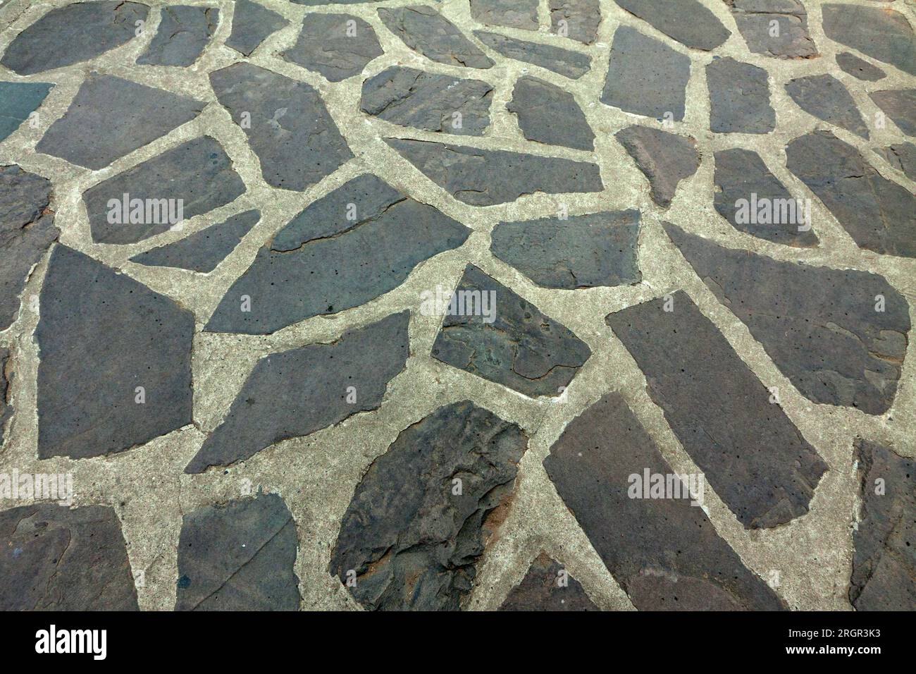 gray stone ground in a park, looks very old Stock Photo - Alamy