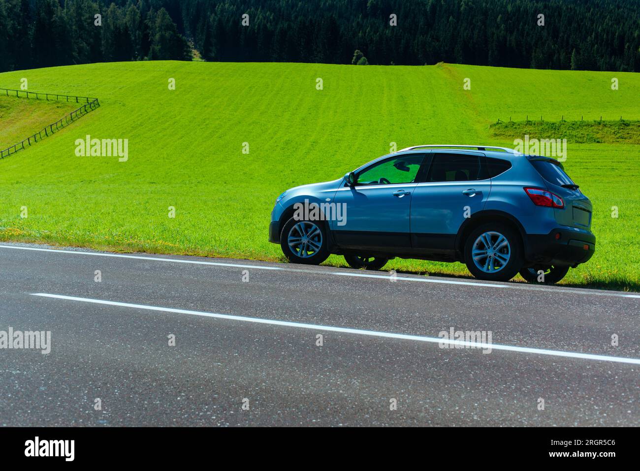 Car standing on side of the road in Europe country Stock Photo - Alamy