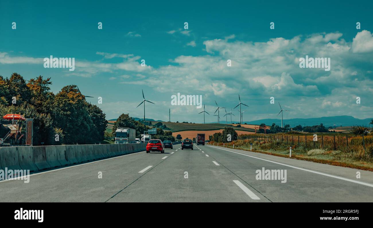 View of the highway and field with wind turbines Stock Photo - Alamy