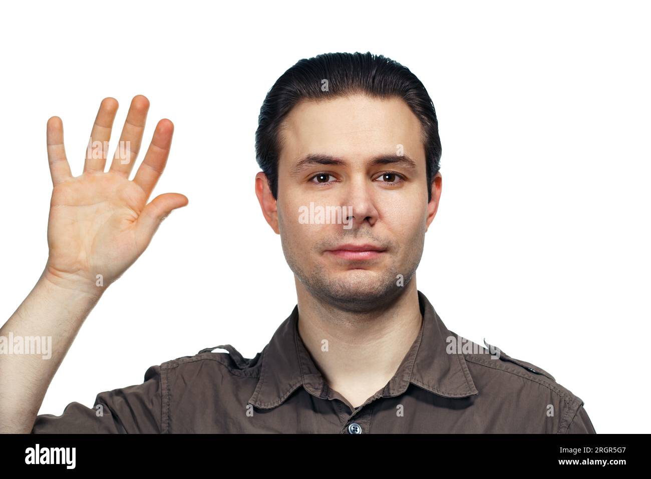 Portrait of young man with his hand up on white background Stock Photo ...
