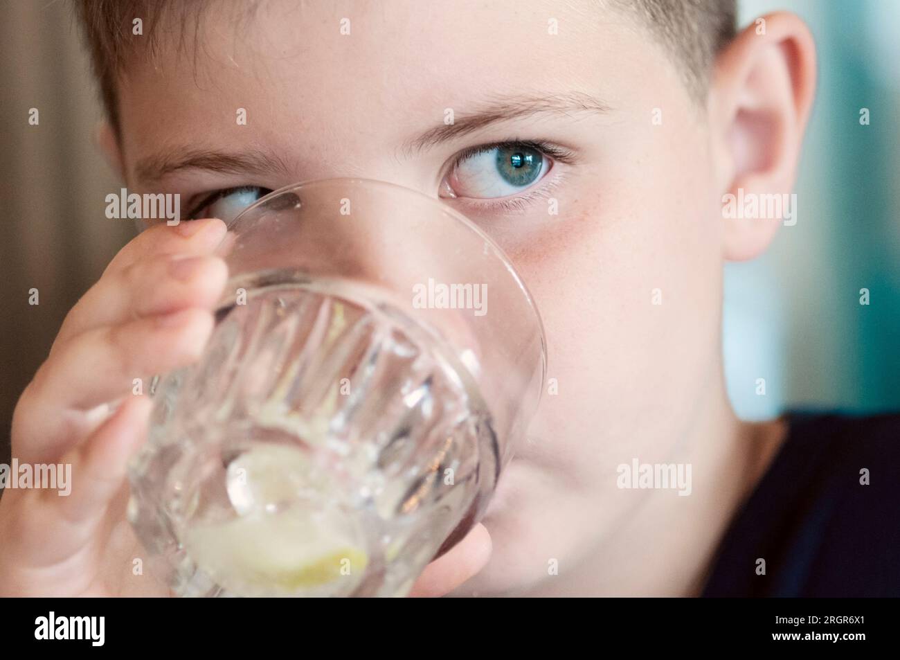 Boy Drinking From Glass Stock Photo - Alamy
