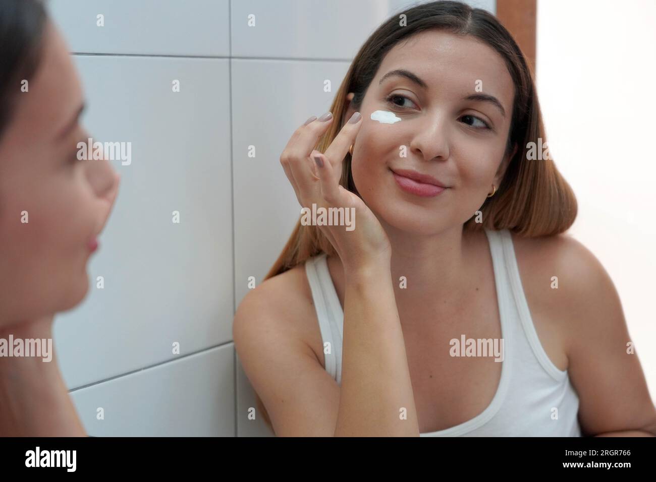 Skin Care Routine At Home Portrait Of Beautiful Girl Applying Cream