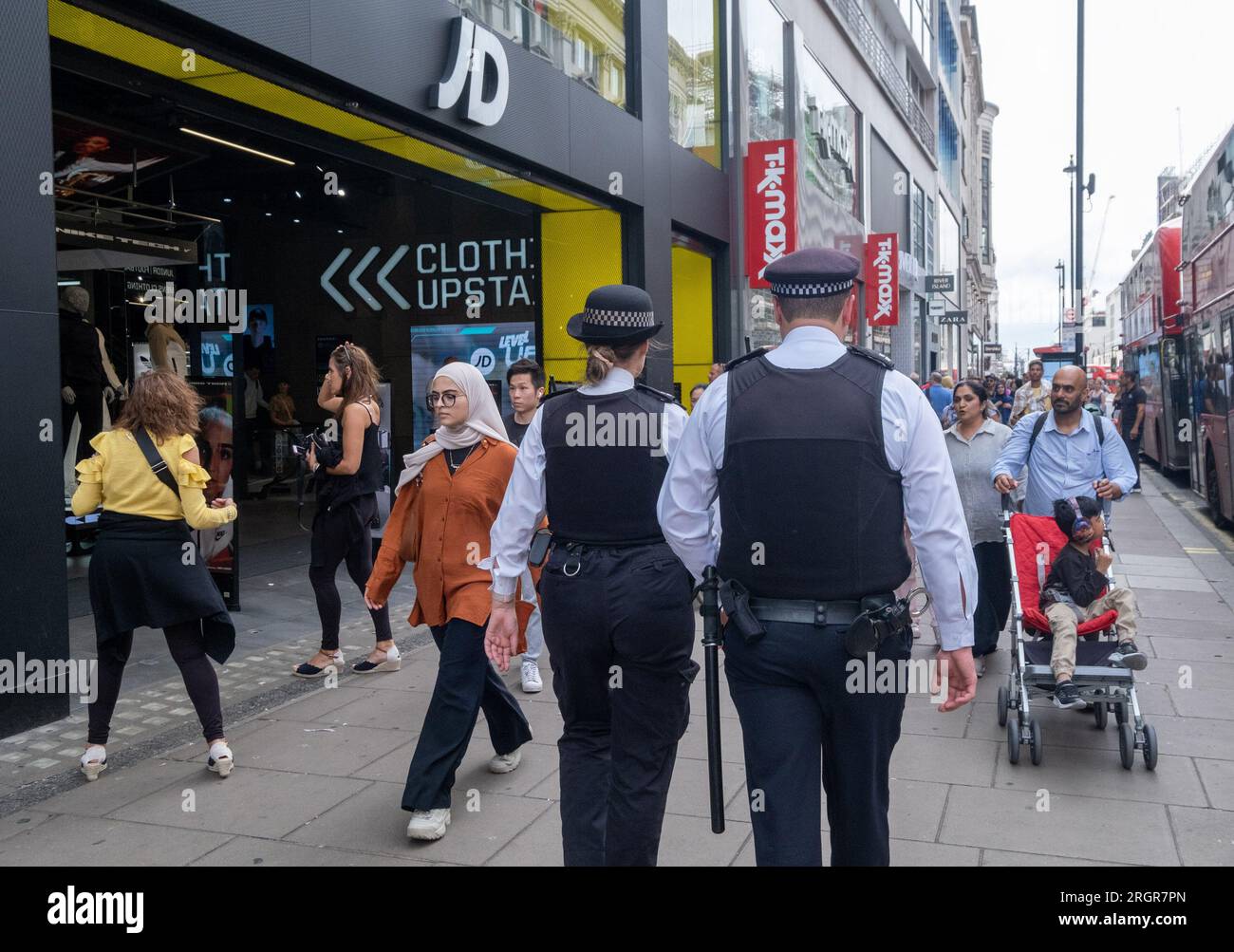 POLICE OXFORD STREET © Jeff Moore - Police officers walk past JD Sports ...