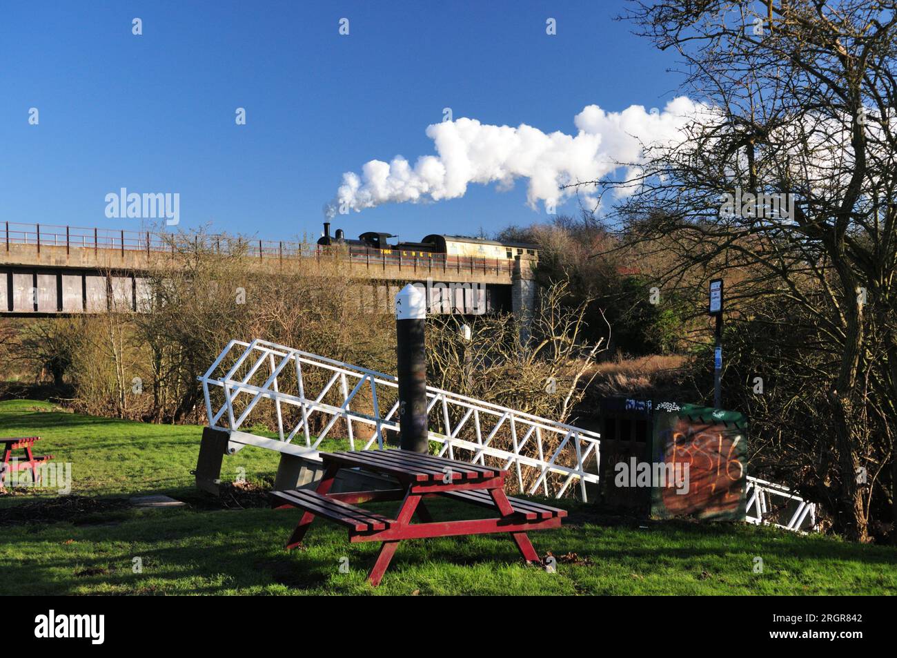 Steam train crossing the river Avon on the Avon Valley Railway near ...