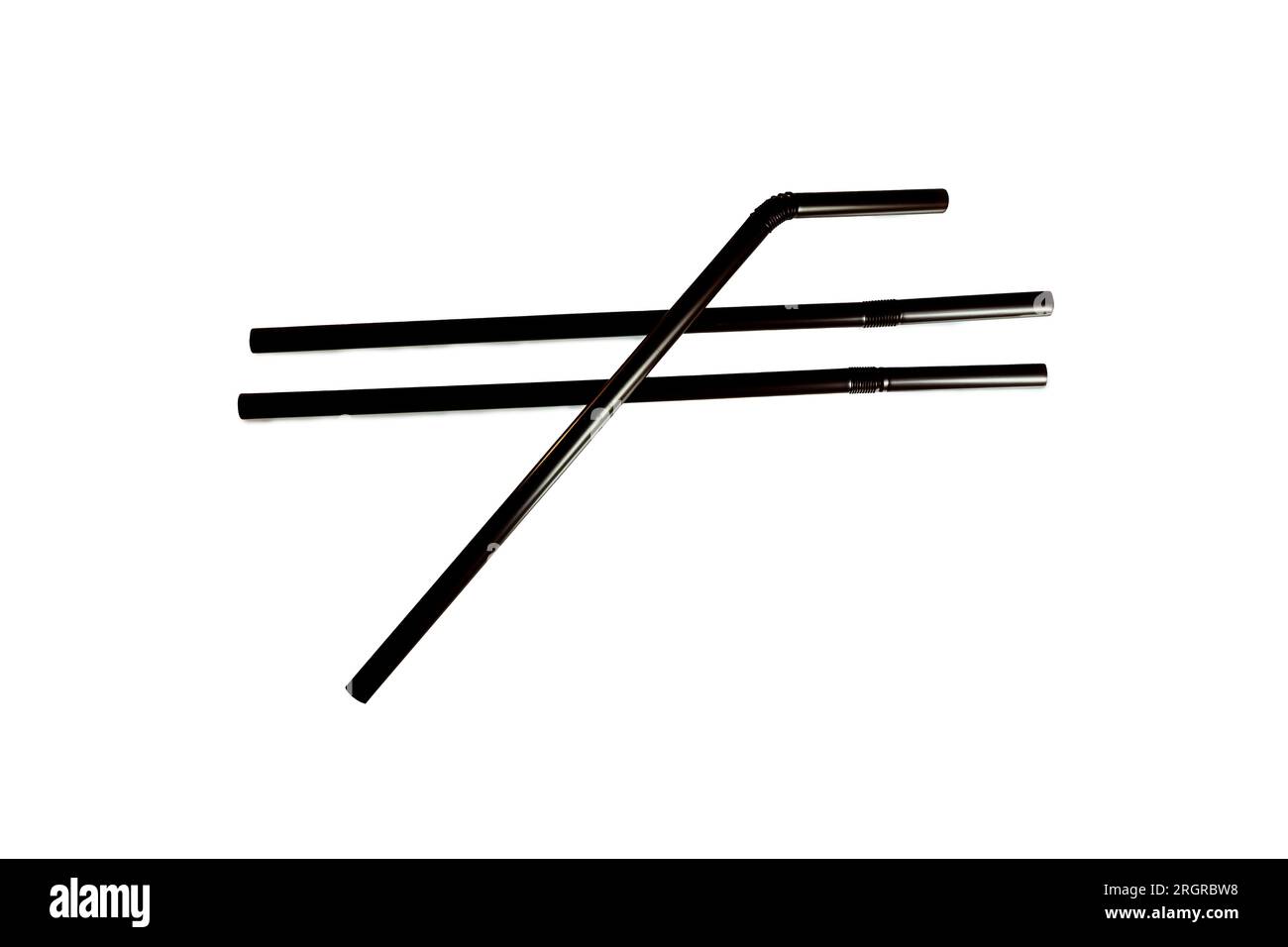 Black plastic single-use straws for beverage drink isolated closeup ...