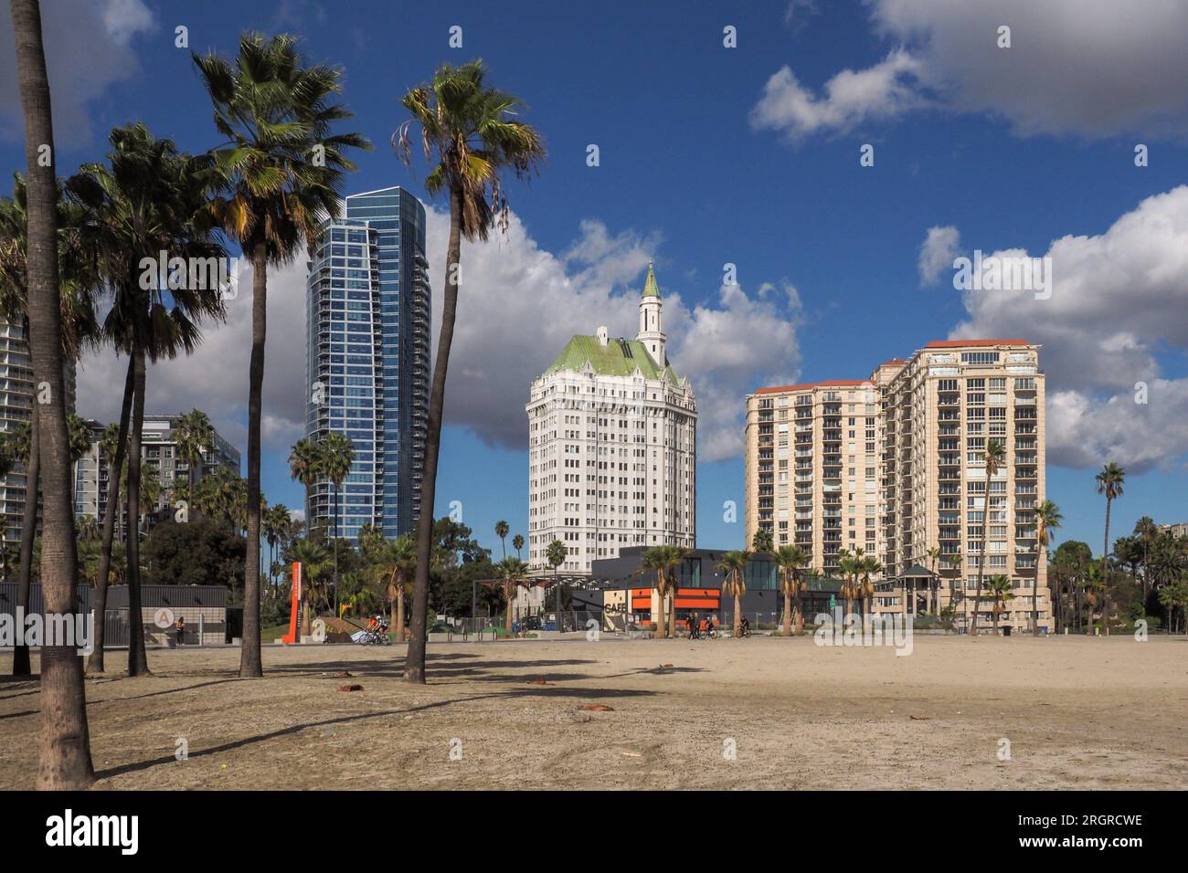 The long, wide beach in Long Beach on the Pacific Ocean is lined from ...