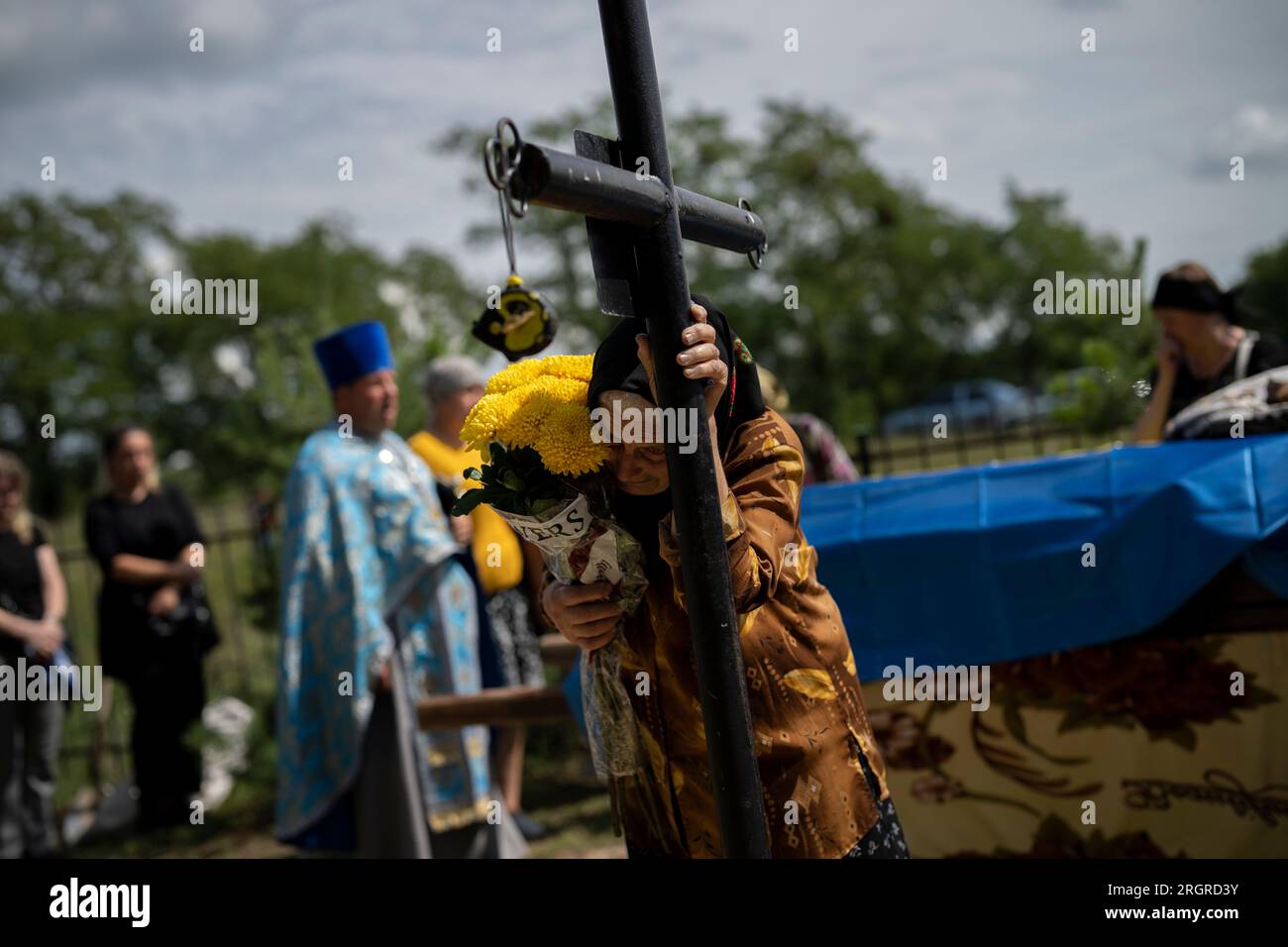 Nadiia, grandmother of Ukrainian soldier Oleksander Mykhailenko, holds ...