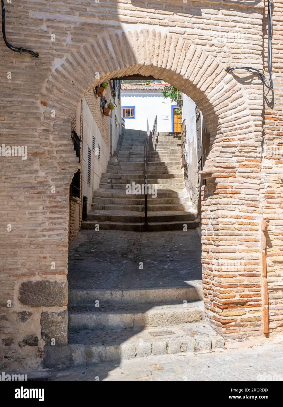 Gate into the old town of Toledo, Spain. Arch in the back streets of ...