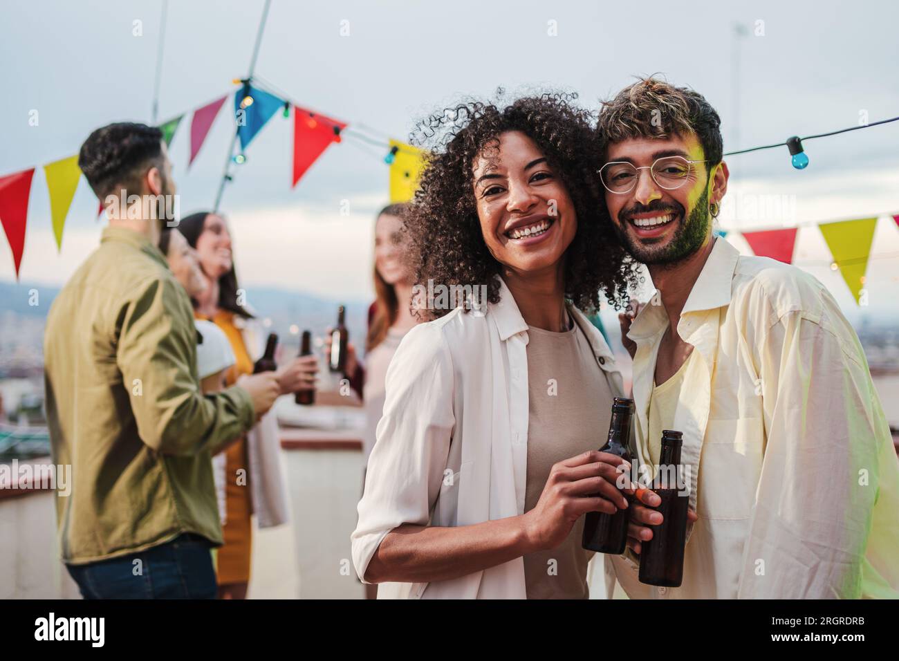 Portrait of young adult multiracial couple smiling, laughing and ...