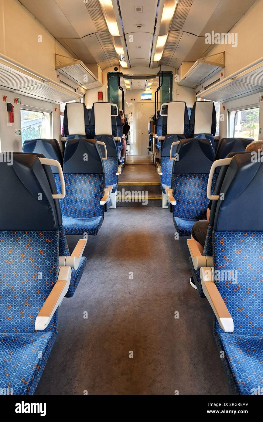 Passenger car in train with blue seats. Passenger rail transport ...