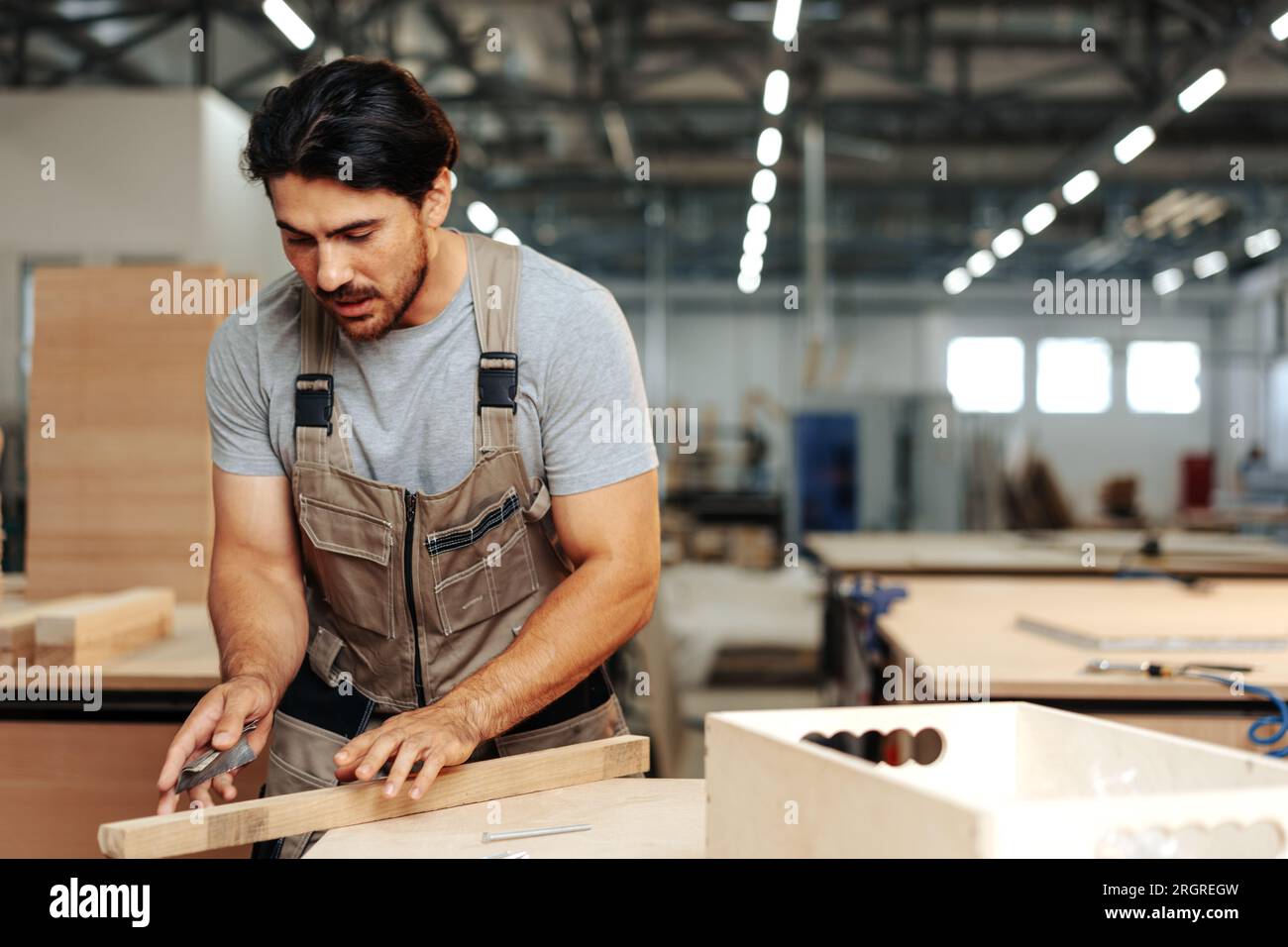 A Carpenter Is Making A Brace For A Chairnull