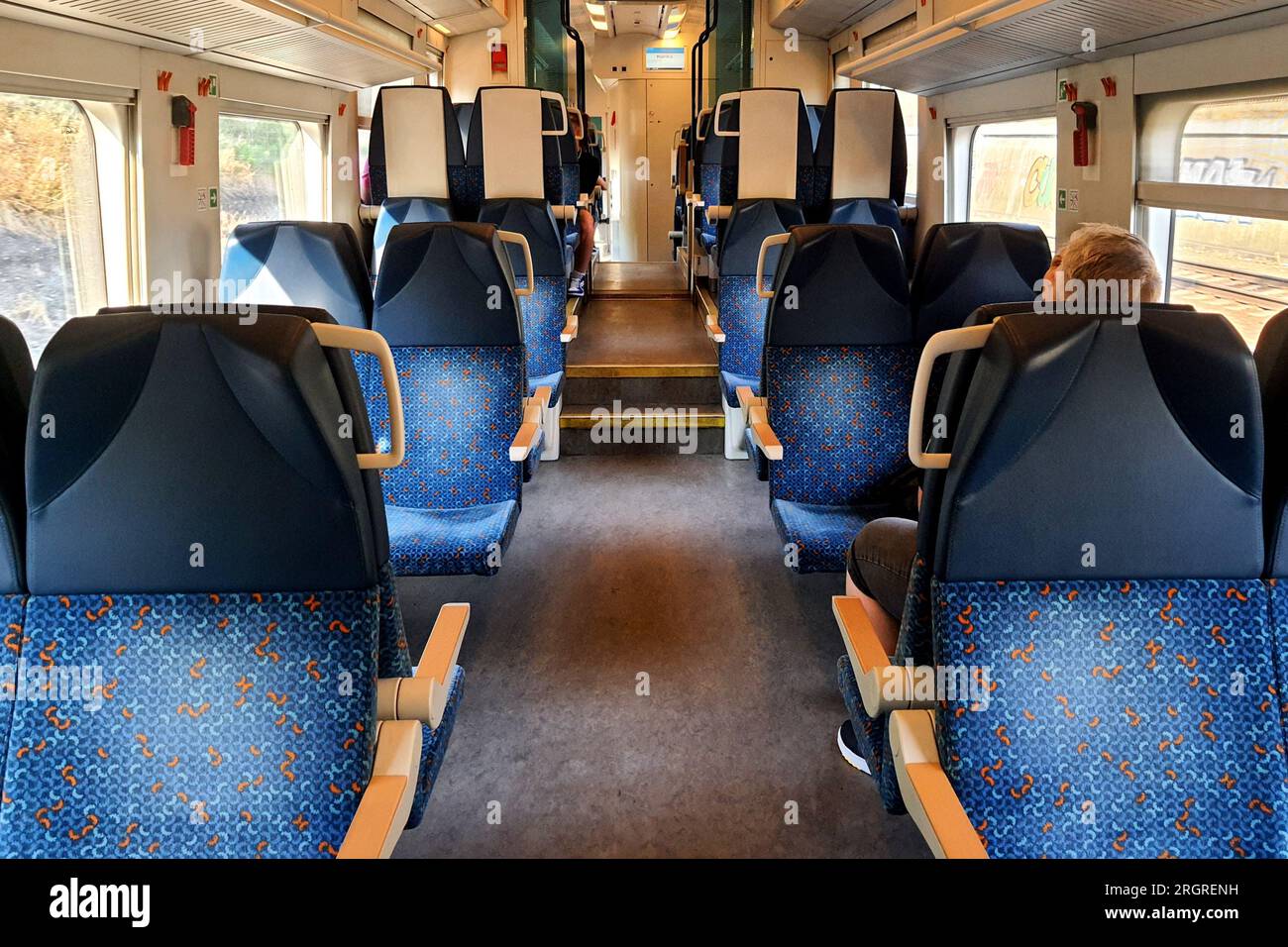 Passenger car in train with blue seats. Passenger rail transport ...