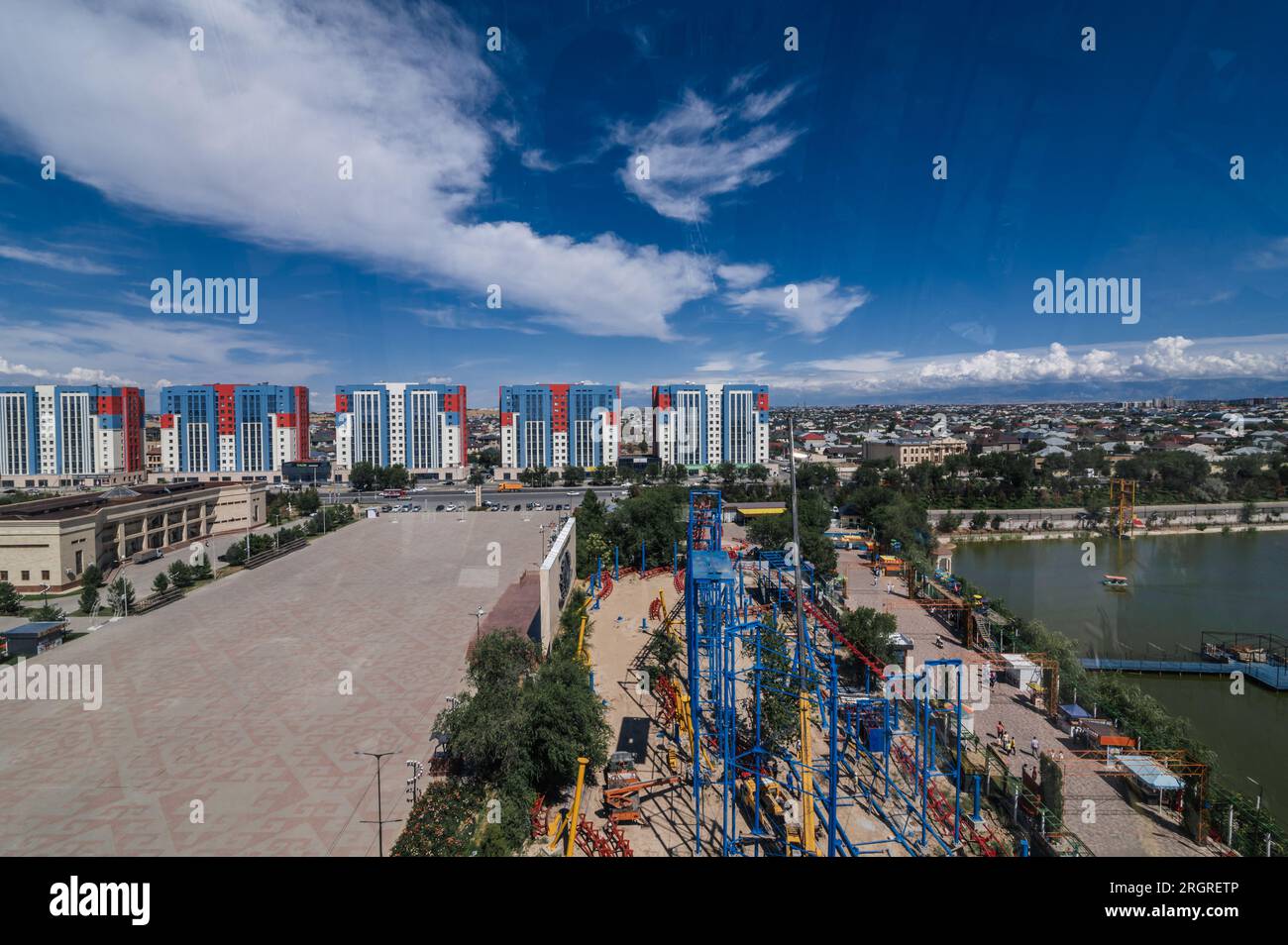 Top view from the Ferris wheel of the Altyn Eye Park and lake in ...