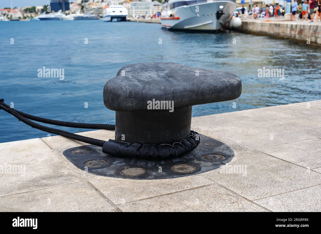 Bollard in a port for mooring ships Stock Photo - Alamy