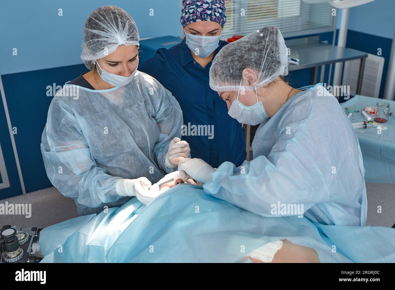 Close up of the face of a patient who is undergoing blepharoplasty. The ...