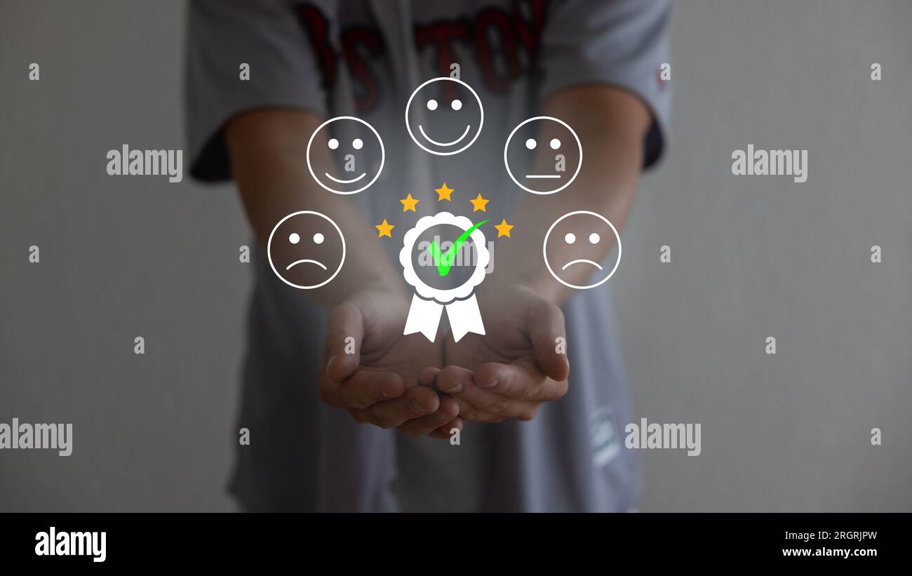 Hand shows the sign of the top service Quality assurance 5 star ...