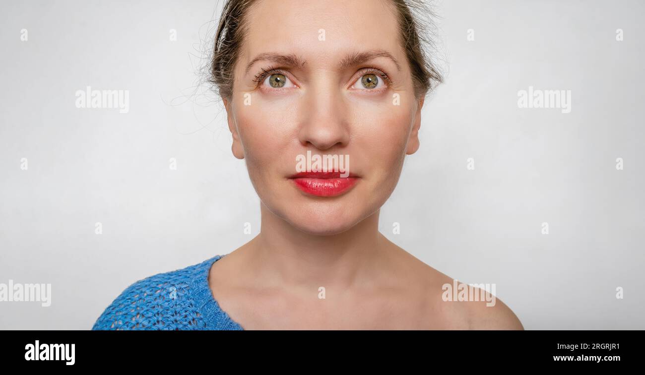Portrait of a beautiful charming woman over a white background ...