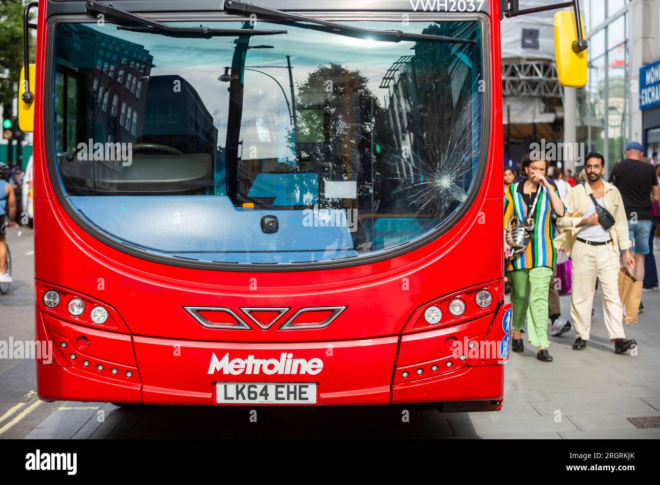 London, UK. 11 August 2023. Members of the public pass a double-decker ...