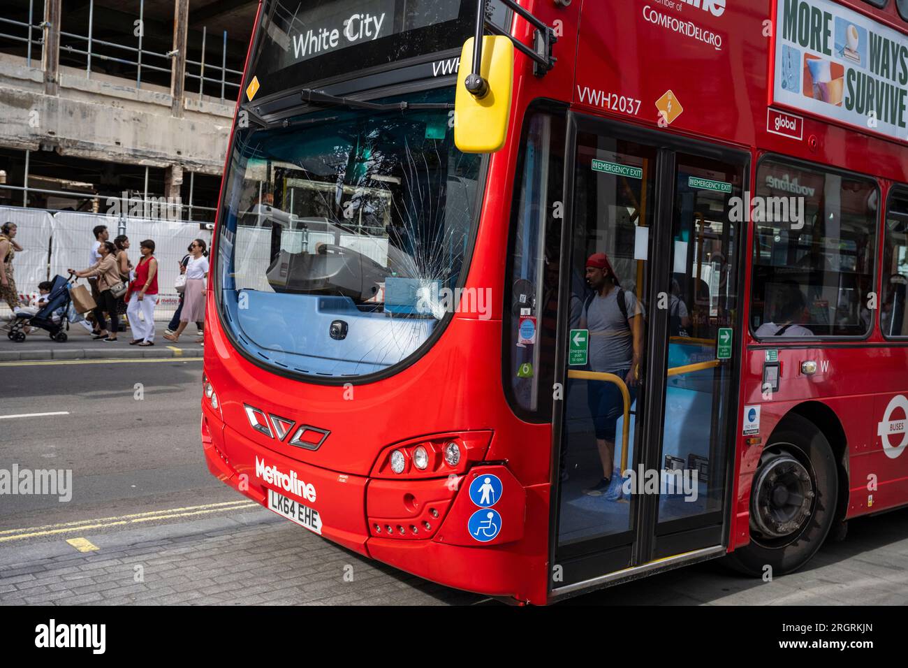 London, UK. 11 August 2023. Members of the public pass a double-decker ...
