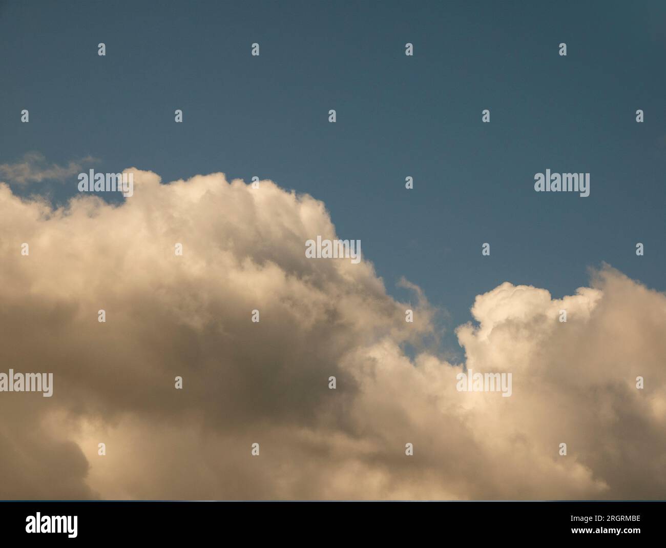 White clouds over sunset sky background. Fluffy cumulus clouds shape ...