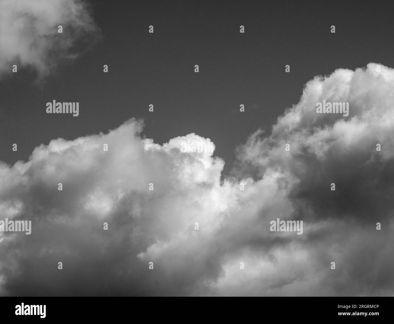 White clouds over sky black and white background. Fluffy cumulus clouds ...