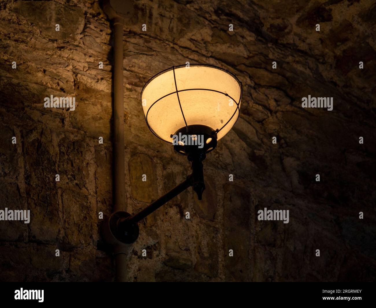 Old ancient lamp on the wall of a prison background, gloomy light Stock ...