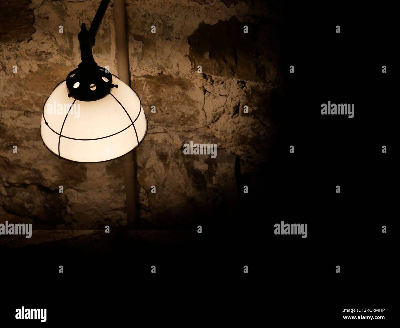 Old ancient lamp on the wall of a prison background, gloomy light Stock ...