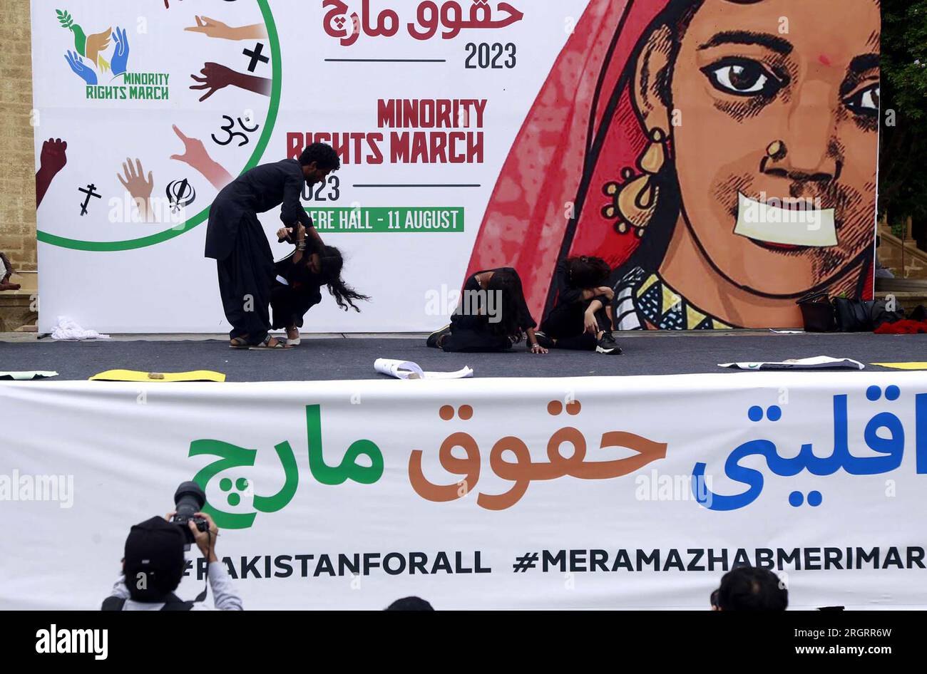 Artists are performing tableau on stage during the Minority Rights ...