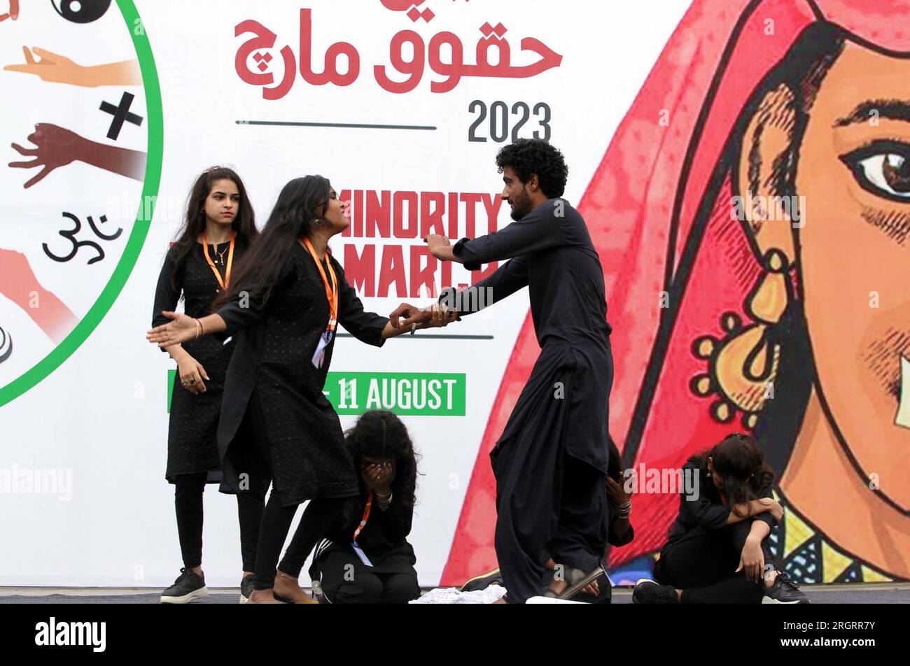 Artists are performing tableau on stage during the Minority Rights ...