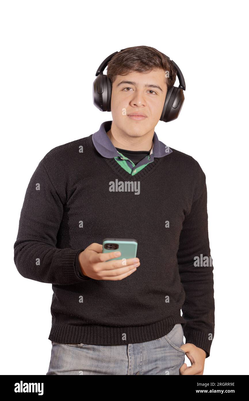 Portrait of a boy with headphones using his mobile phone isolated on ...