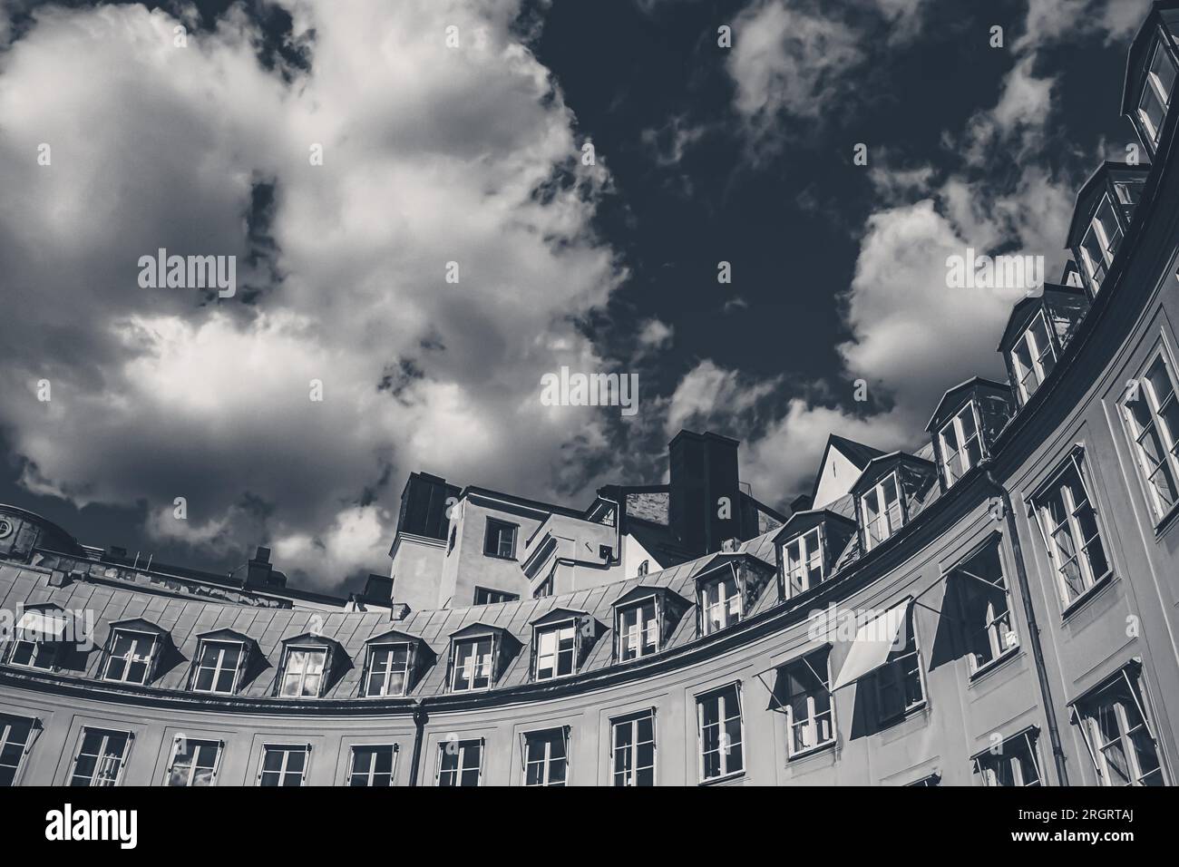 Low angle of building against cloudy sky Stock Photo - Alamy